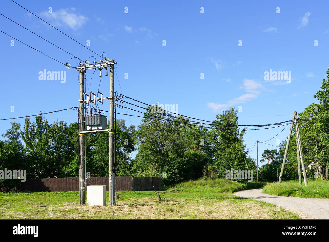wooden power line pole with electric transformer in rural area Stock ...