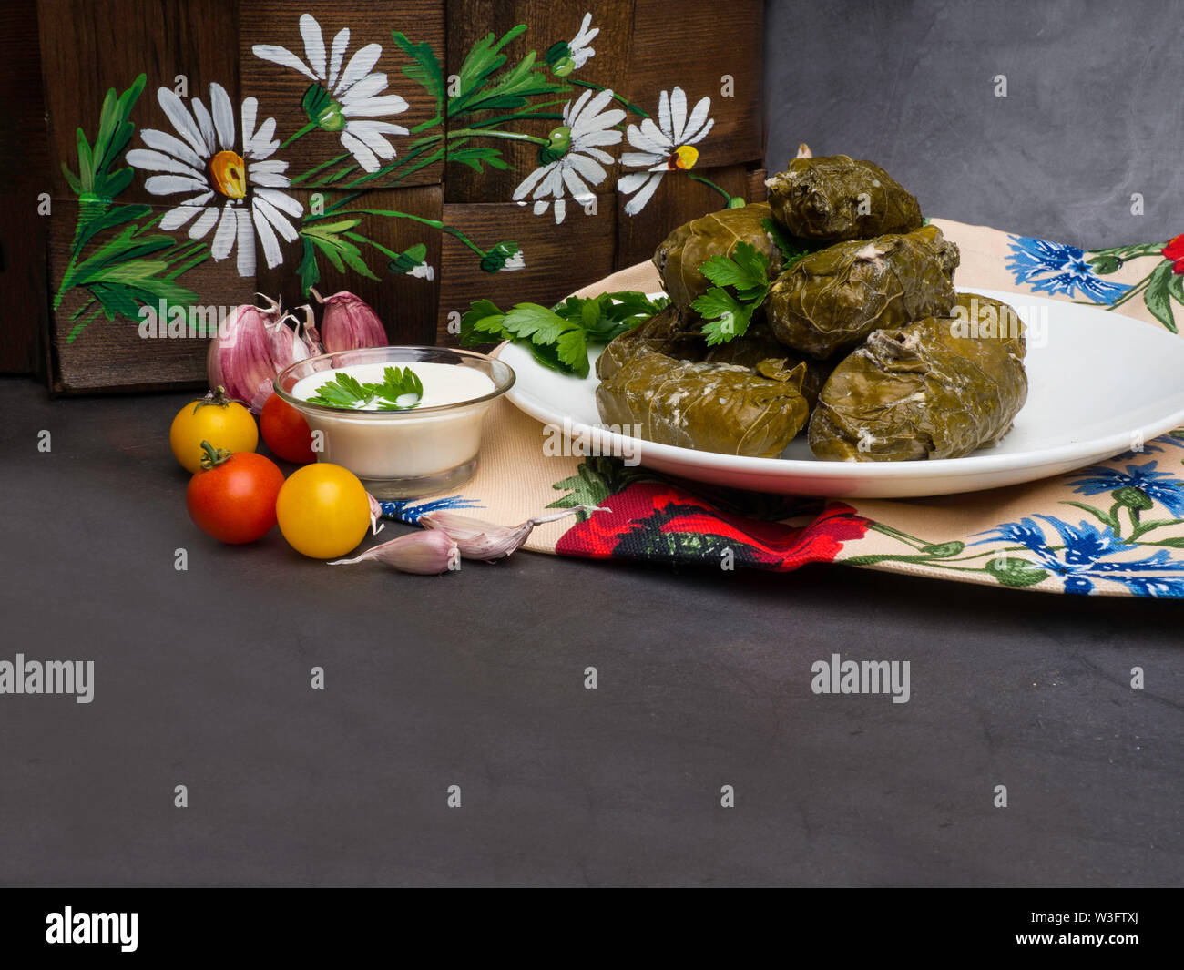 Traditional georgian dolma in grape leaves with parsley, cream ...