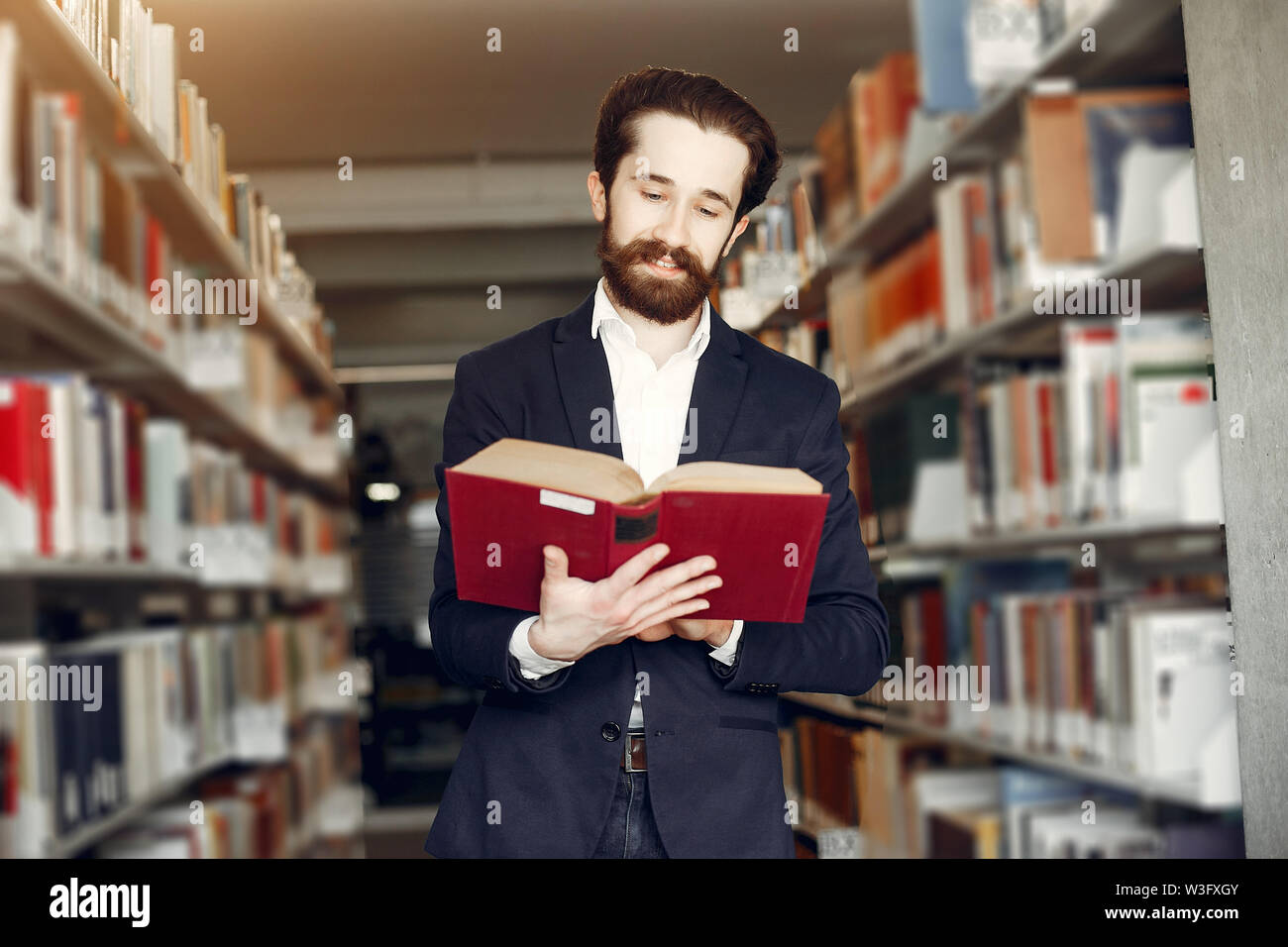 Handsome guy study at the library Stock Photo - Alamy