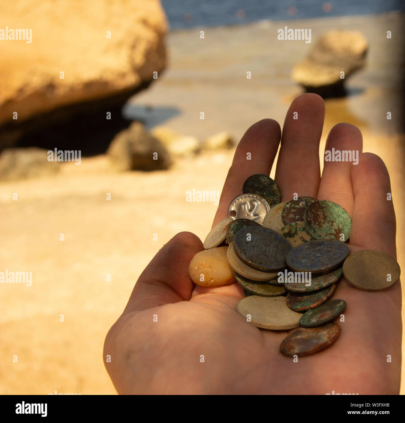 The photo of gold and silver coins collected with help of underwater ...