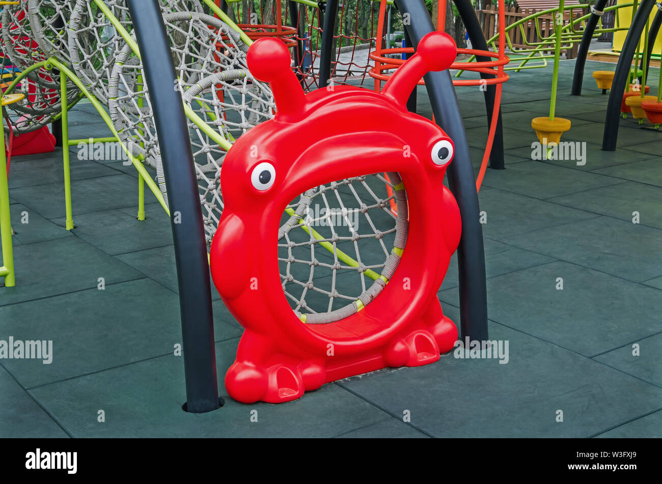 Colorful and motley children playground of networks of the ropes in the ...