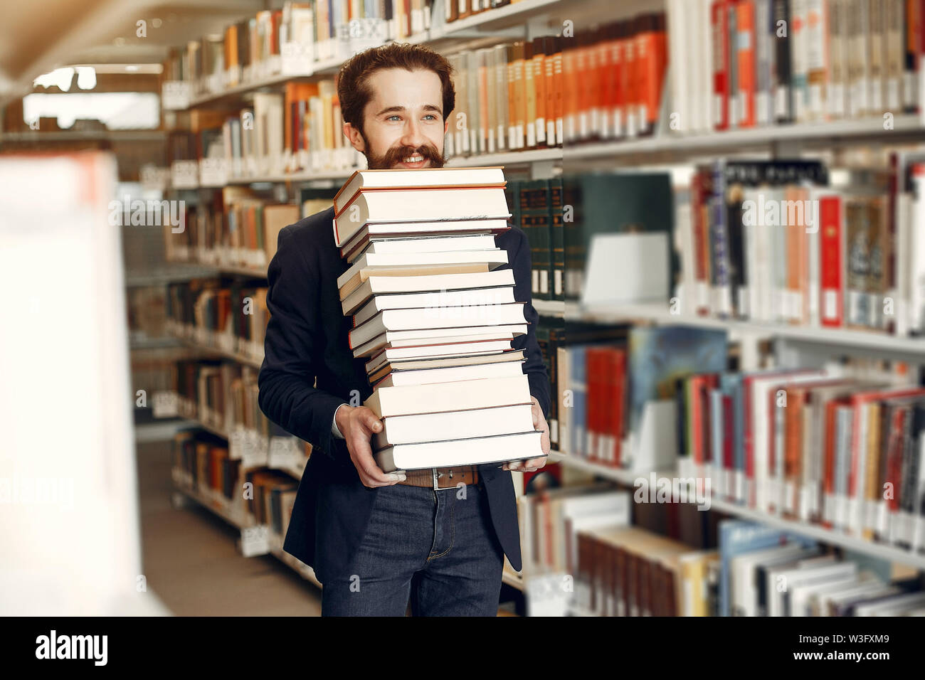 Handsome guy study at the library Stock Photo - Alamy