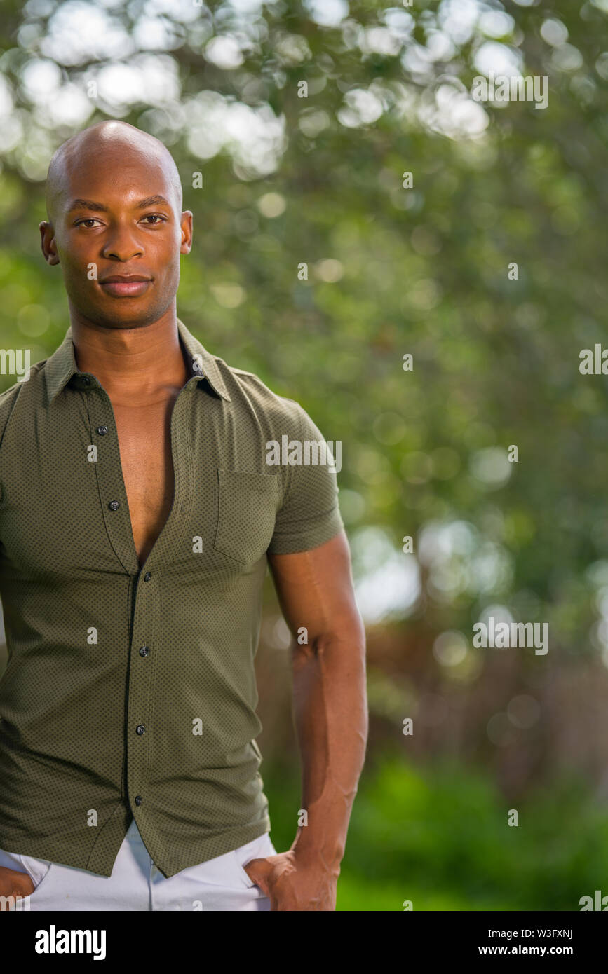 Portrait of a man posing partially off frame. Young African American ...