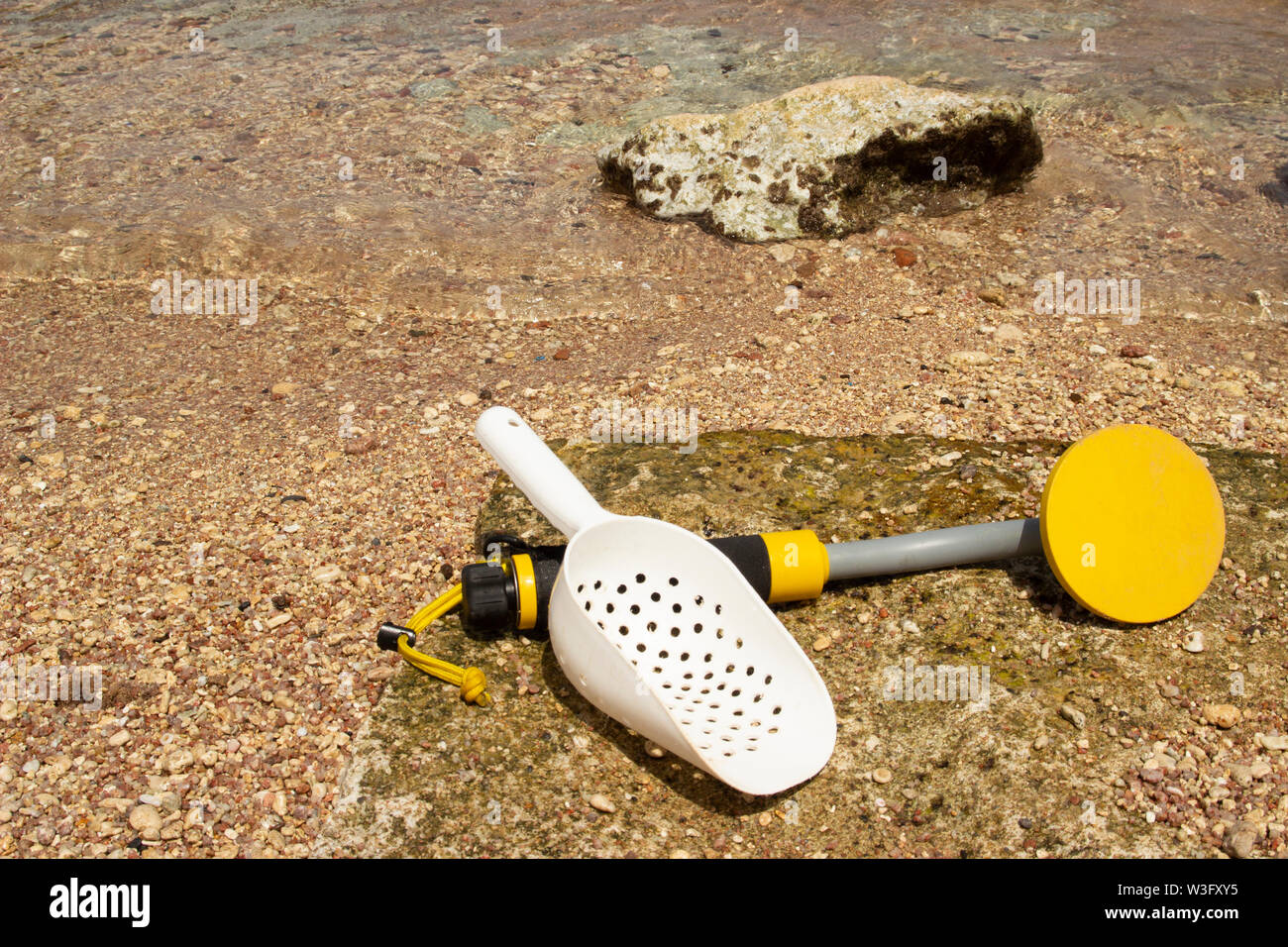 The photo of gold and silver coins collected with help of underwater ...