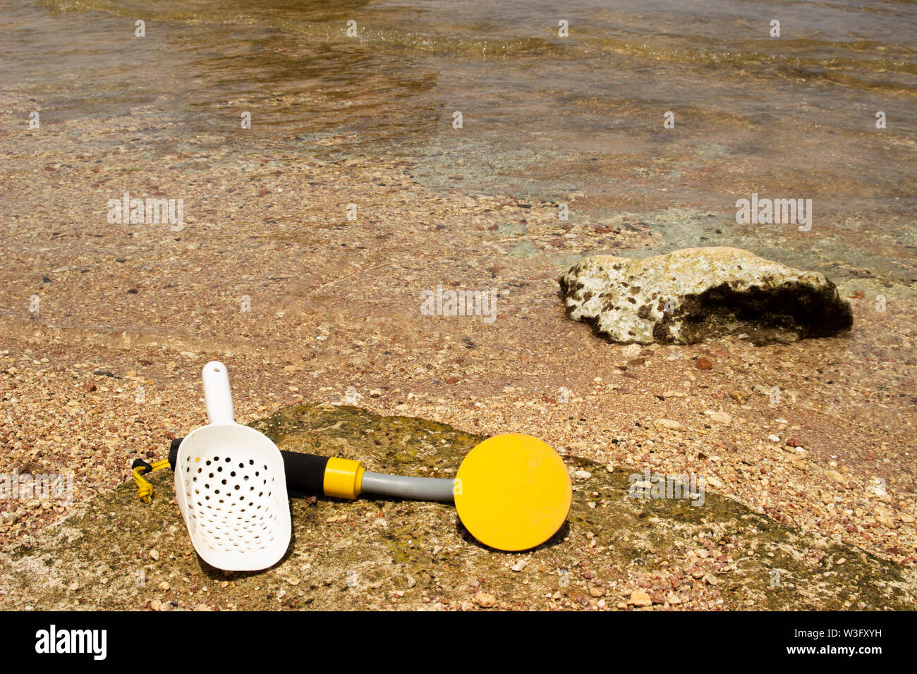 The photo of gold and silver coins collected with help of underwater ...