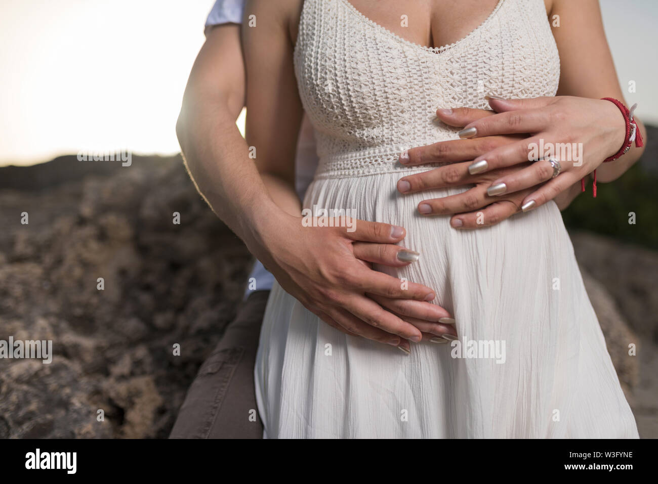Young expecting parents on white hi-res stock photography and images ...