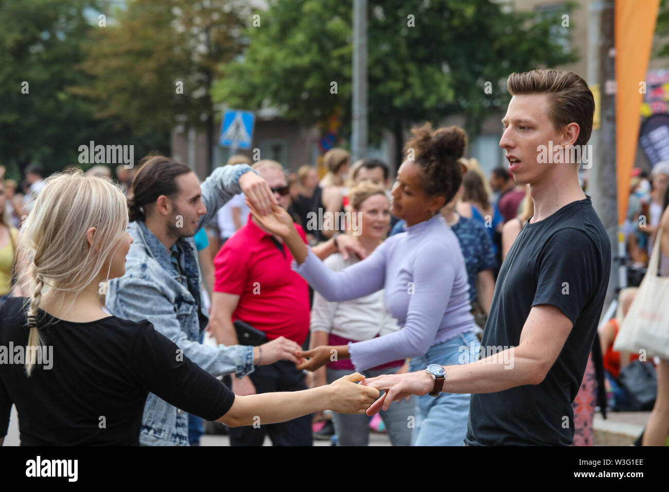 Couples dancing in the streets of Hakaniemi at Kallio Block Party in ...