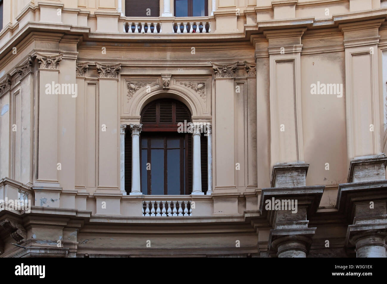 Old traditional Italian architecture facade with columns and balcony ...