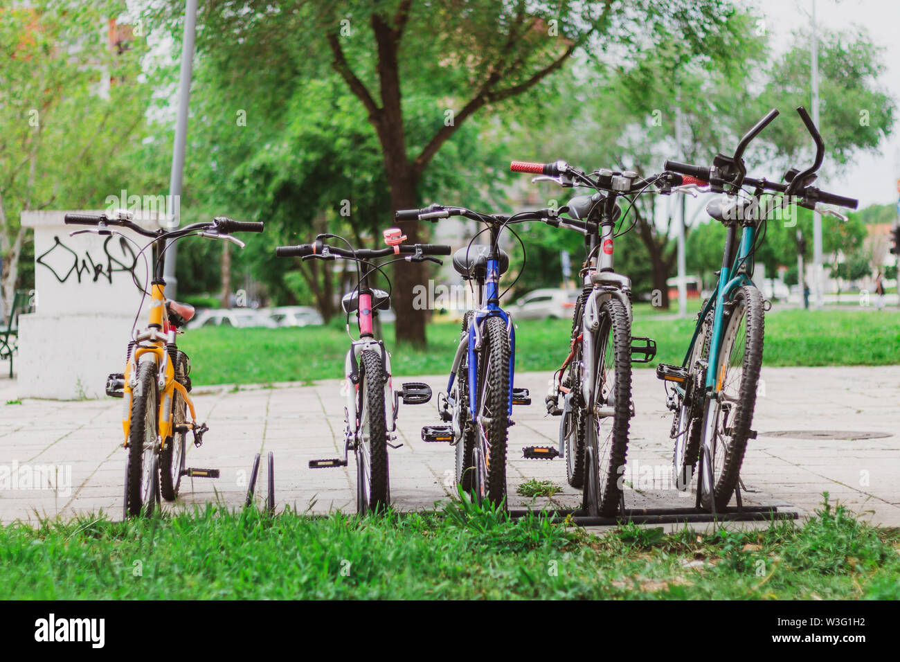 Group of bicycles in the row. Parked bicycles on sidewalk in Belgrade ...