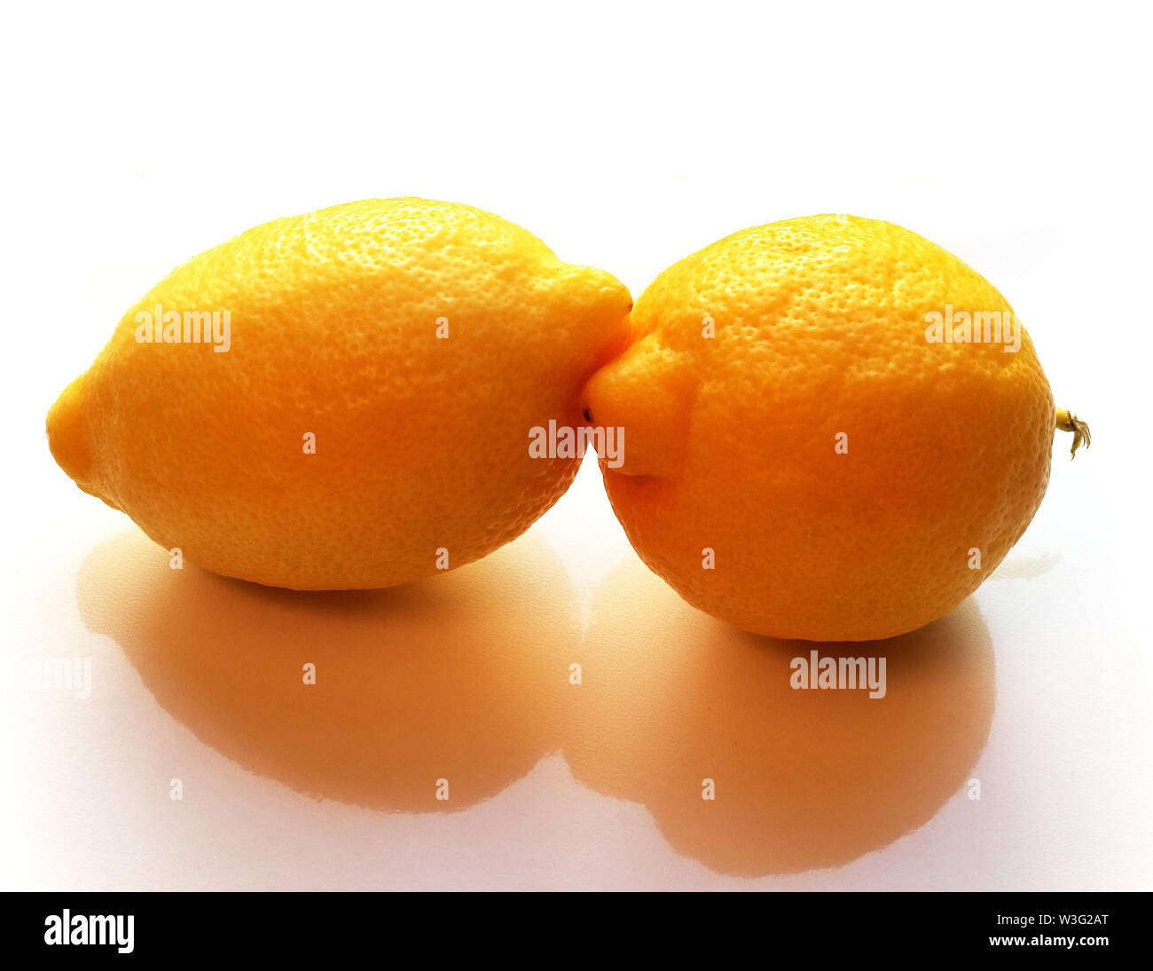 Two yellow lemons isolated on white background Stock Photo - Alamy
