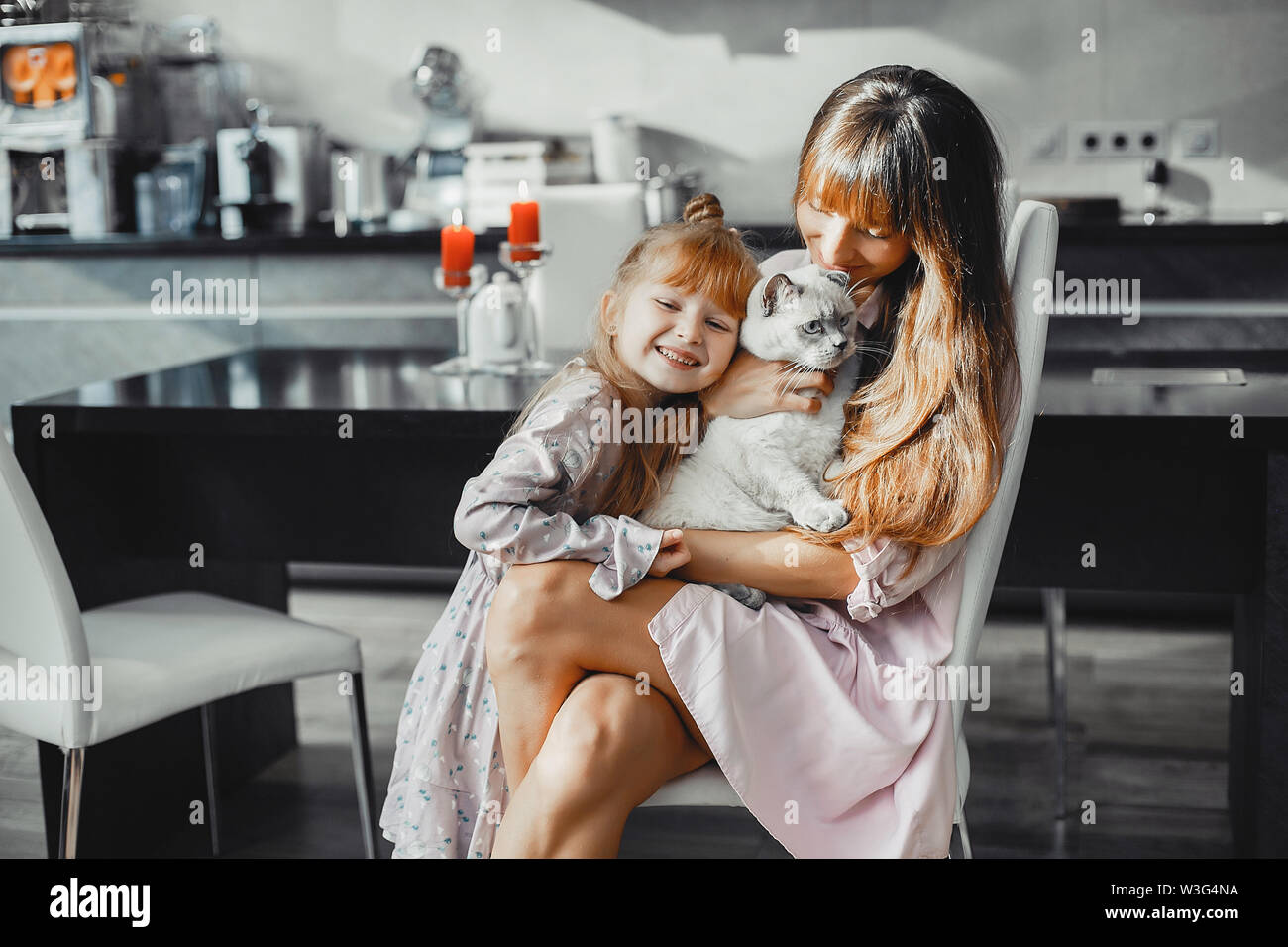 Mother with daughter at home Stock Photo - Alamy