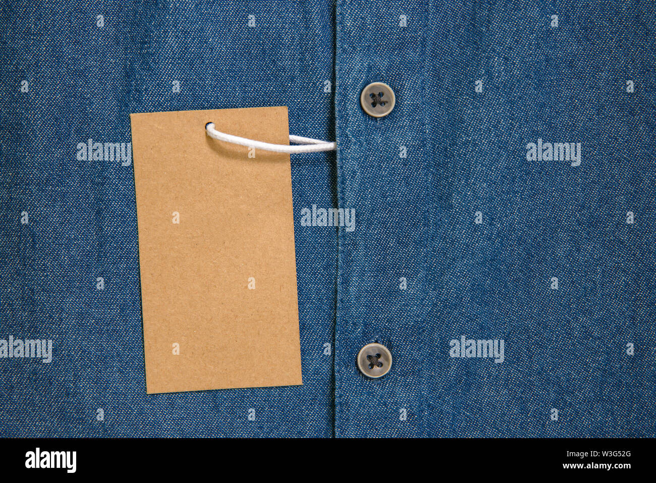 paper denim tag with buttons Stock Photo - Alamy