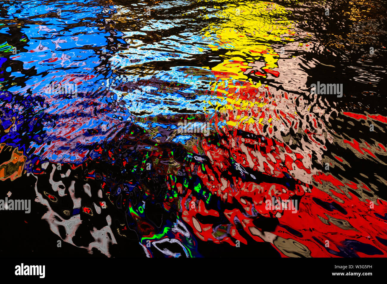 Colorful neon shop signs reflection on water Stock Photo - Alamy