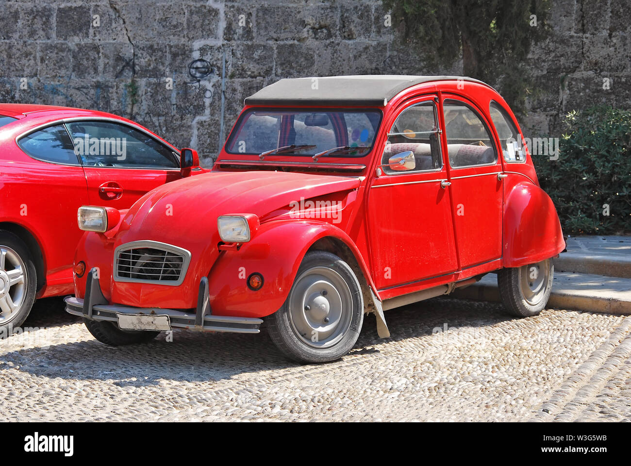 Red vintage car with a folding roof Stock Photo - Alamy