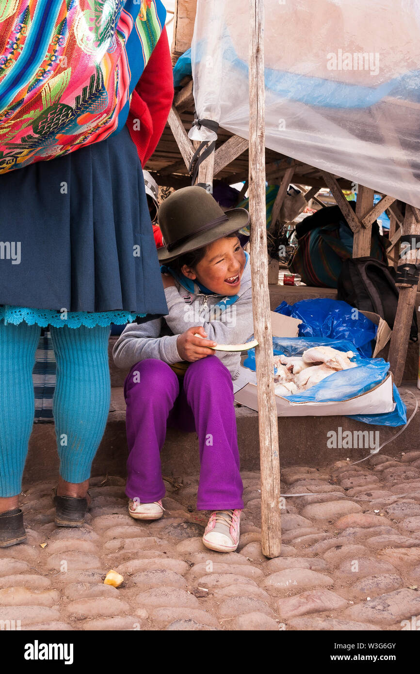 Kid winking at a street market Stock Photo - Alamy