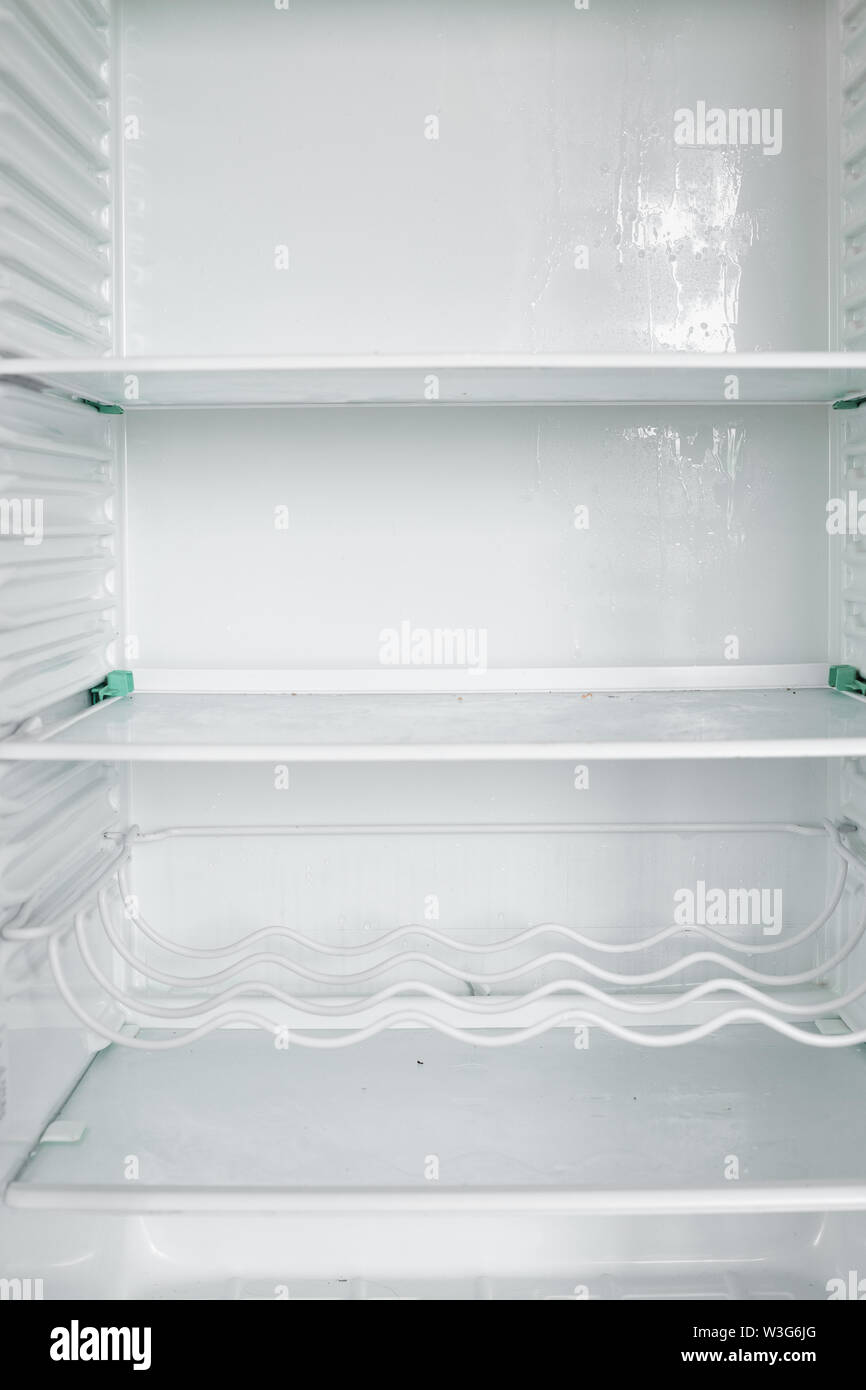 Front view of empty refrigerator staying at home Stock Photo - Alamy