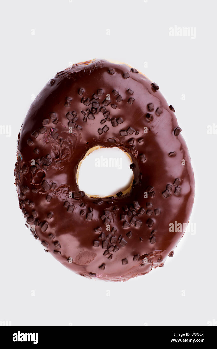 Chocolate crunch doughnut, top view Stock Photo - Alamy
