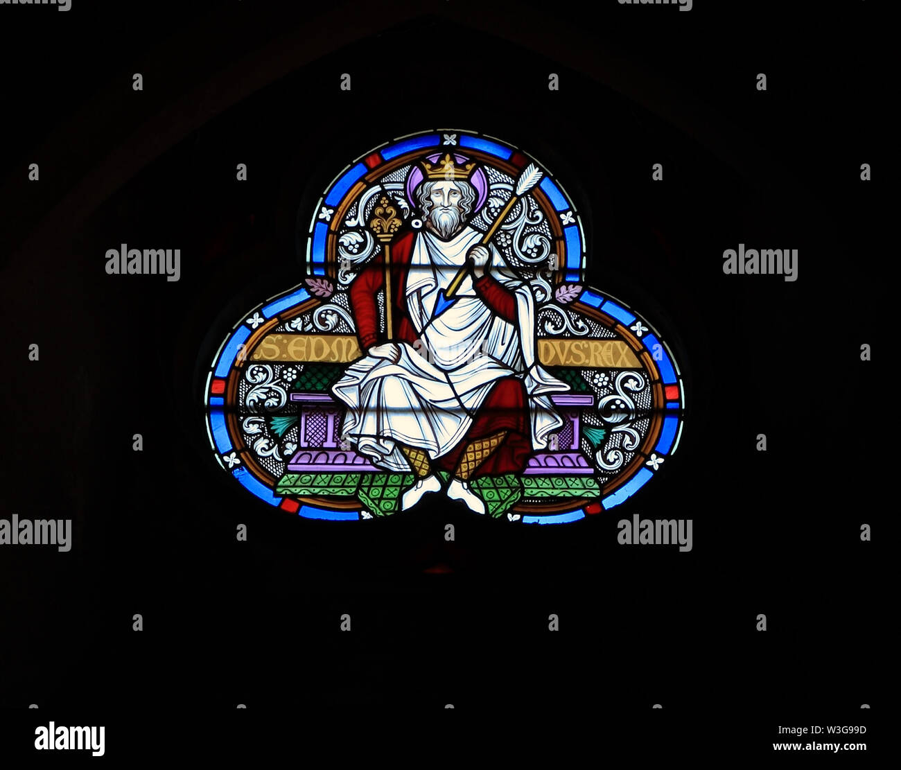 St. Edmund, King of East Anglia, holding arrow, stained glass window ...