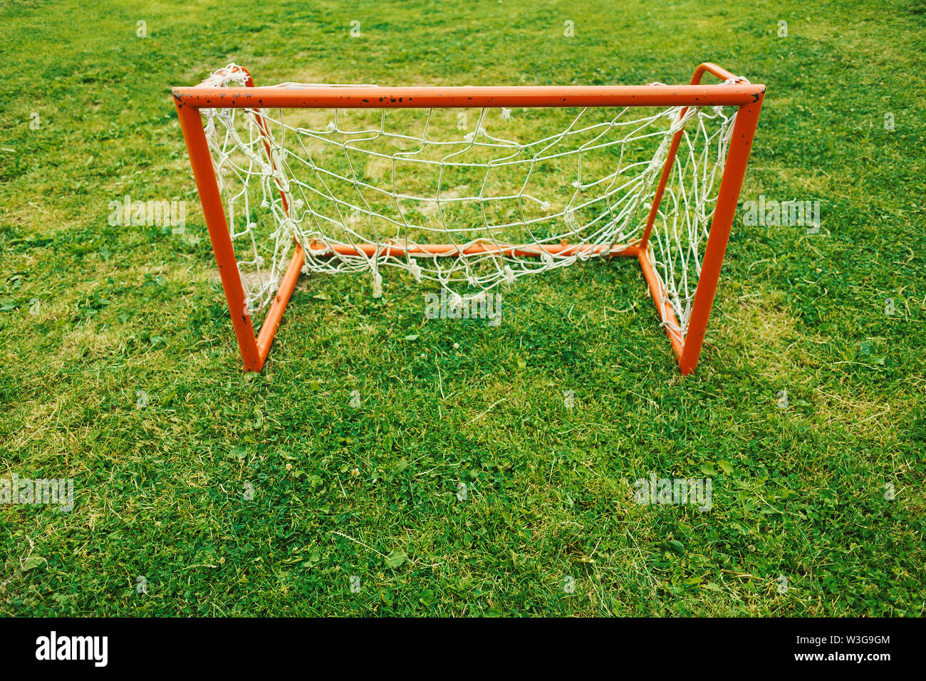 Small football goal on fresh green grass, abstract composition Stock ...