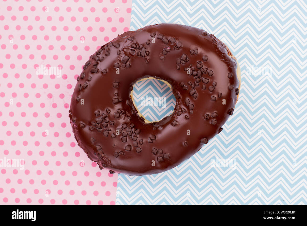 Chocolate donut on color background Stock Photo - Alamy