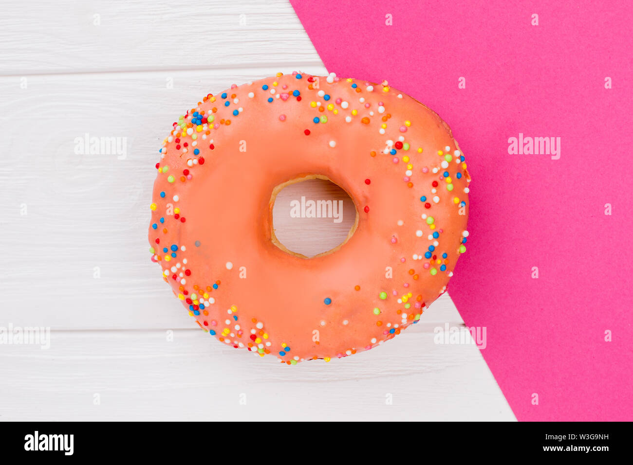 Colorful donut orange icing hi-res stock photography and images - Alamy
