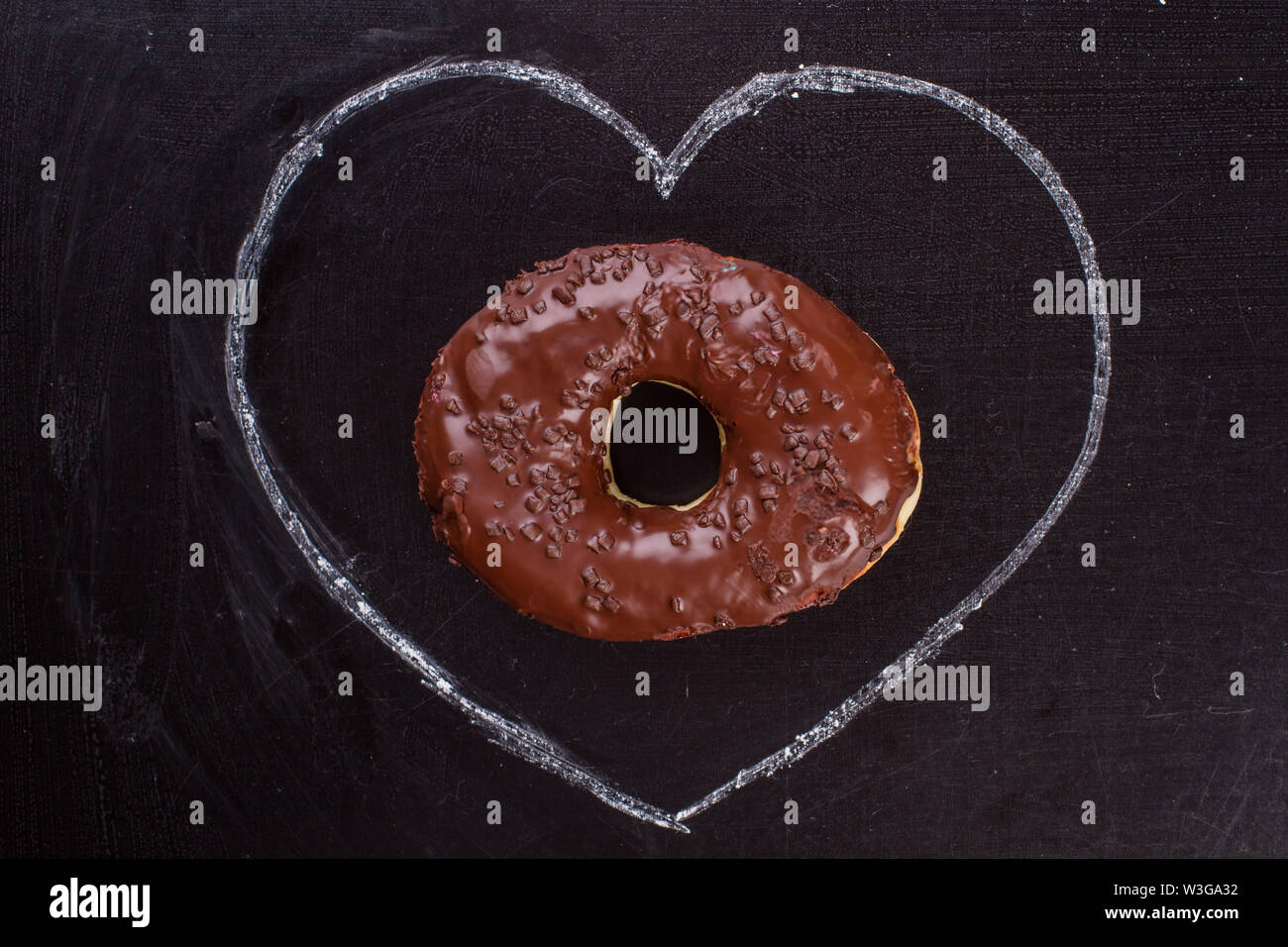 Chocolate donut and drawn heart shape Stock Photo - Alamy