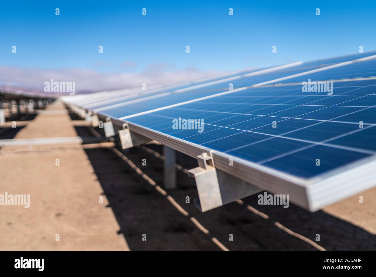 Hundreds solar energy panels rows along the dry lands at Atacama Desert ...