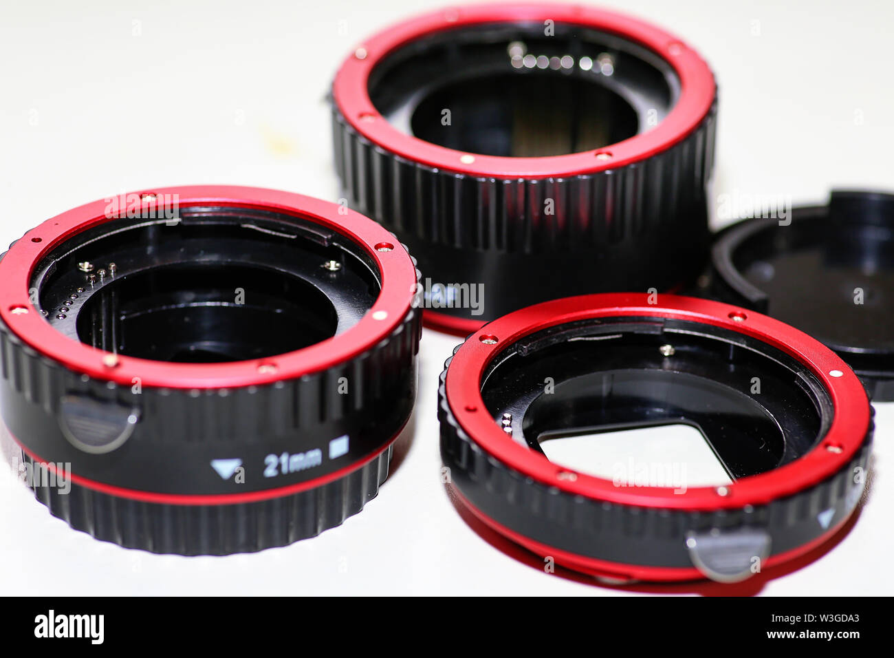 Macro photography camera lens extension tubes in white background Stock ...