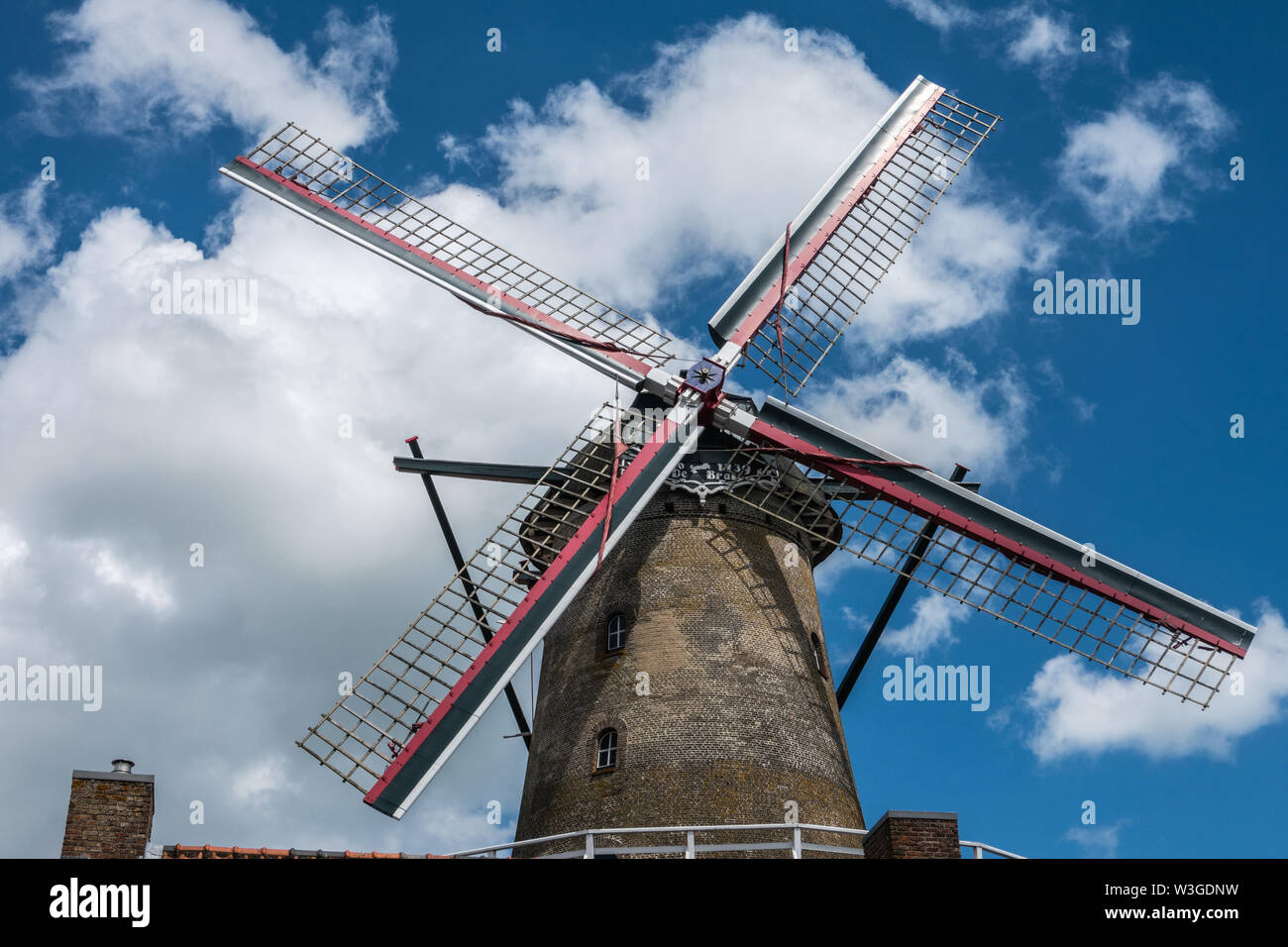 Sluis, the Netherlands - June 16, 2019: The iconic brick-stone windmill ...