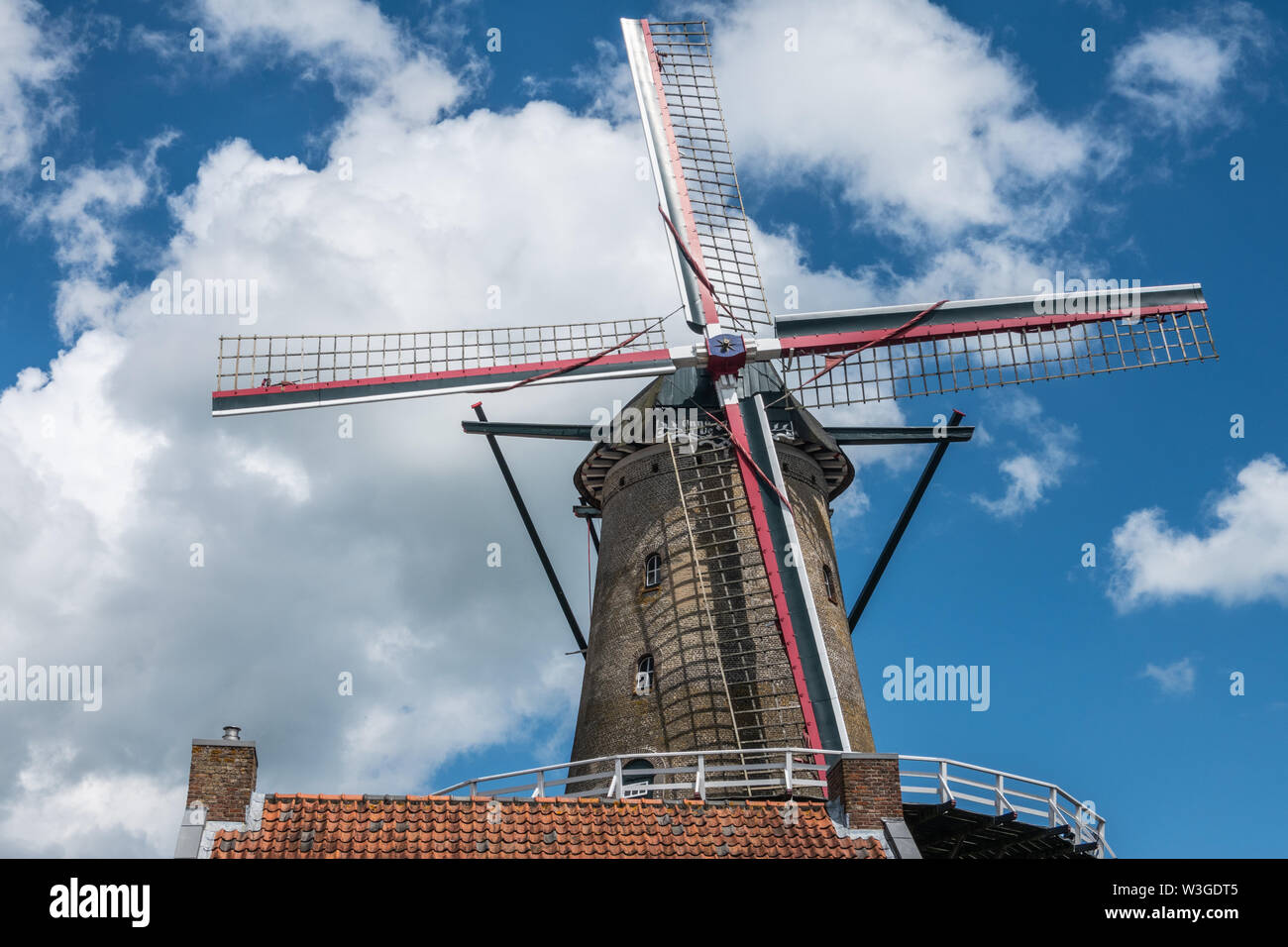 Sluis, the Netherlands - June 16, 2019: The iconic brick-stone windmill ...