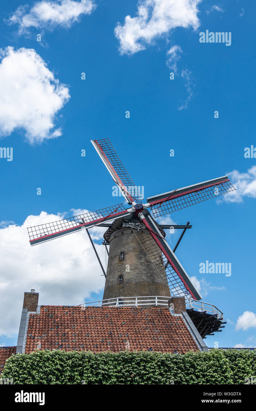 Sluis, the Netherlands - June 16, 2019: The iconic brick-stone windmill ...