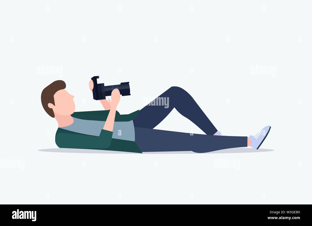 professional photographer taking photo with digital camera man lying ...