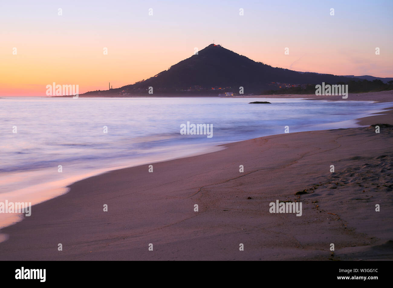 Sunset at the Moledo beach, with a mountain on backgroud Stock Photo ...