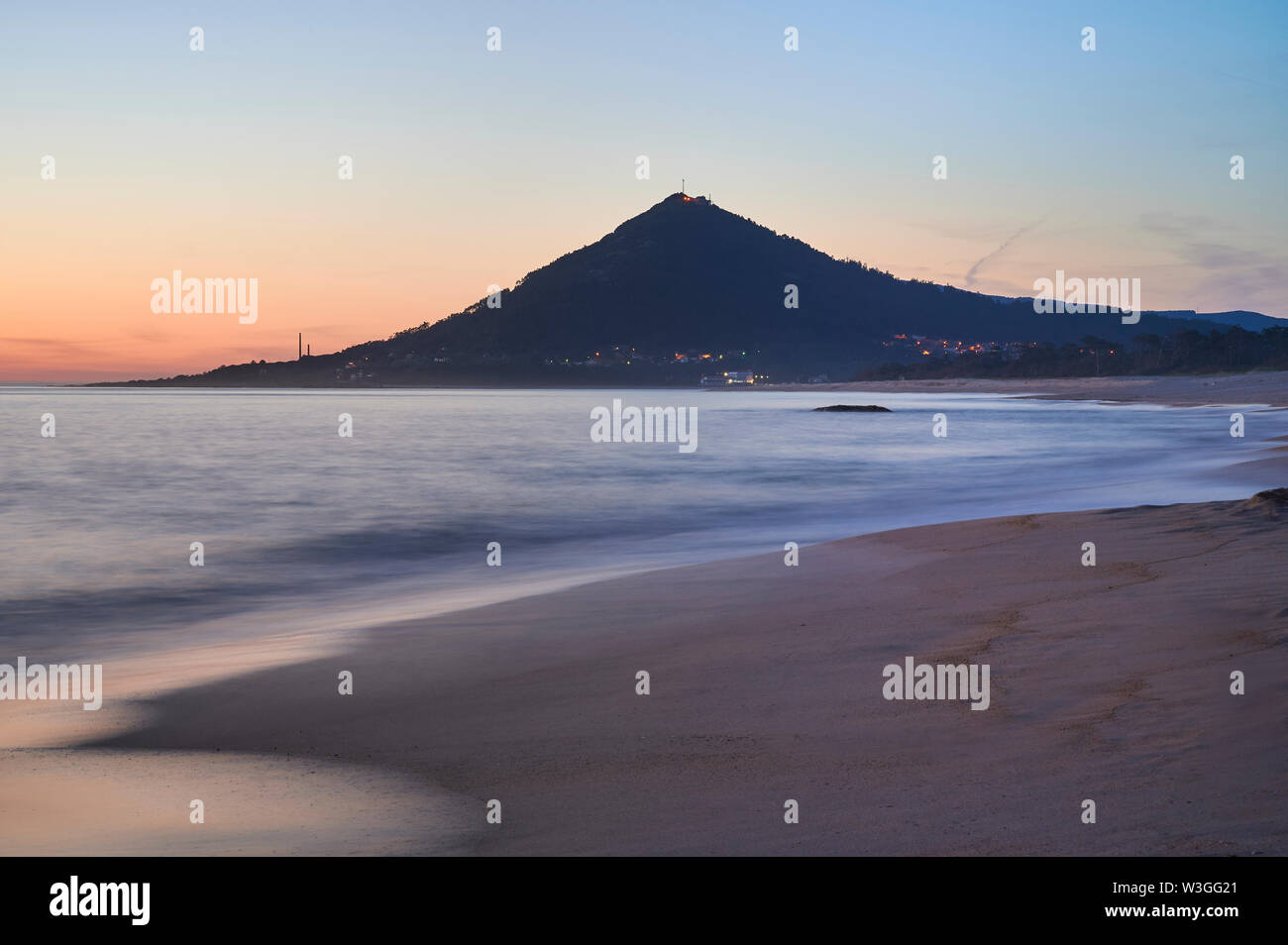 Sunset at the Moledo beach, with a mountain on backgroud Stock Photo ...
