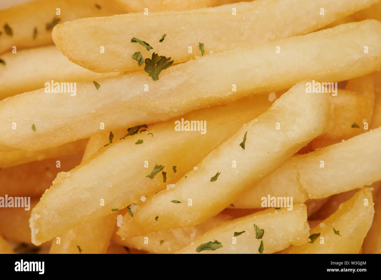 Crispy french fries with salt anf herb macro view Stock Photo - Alamy