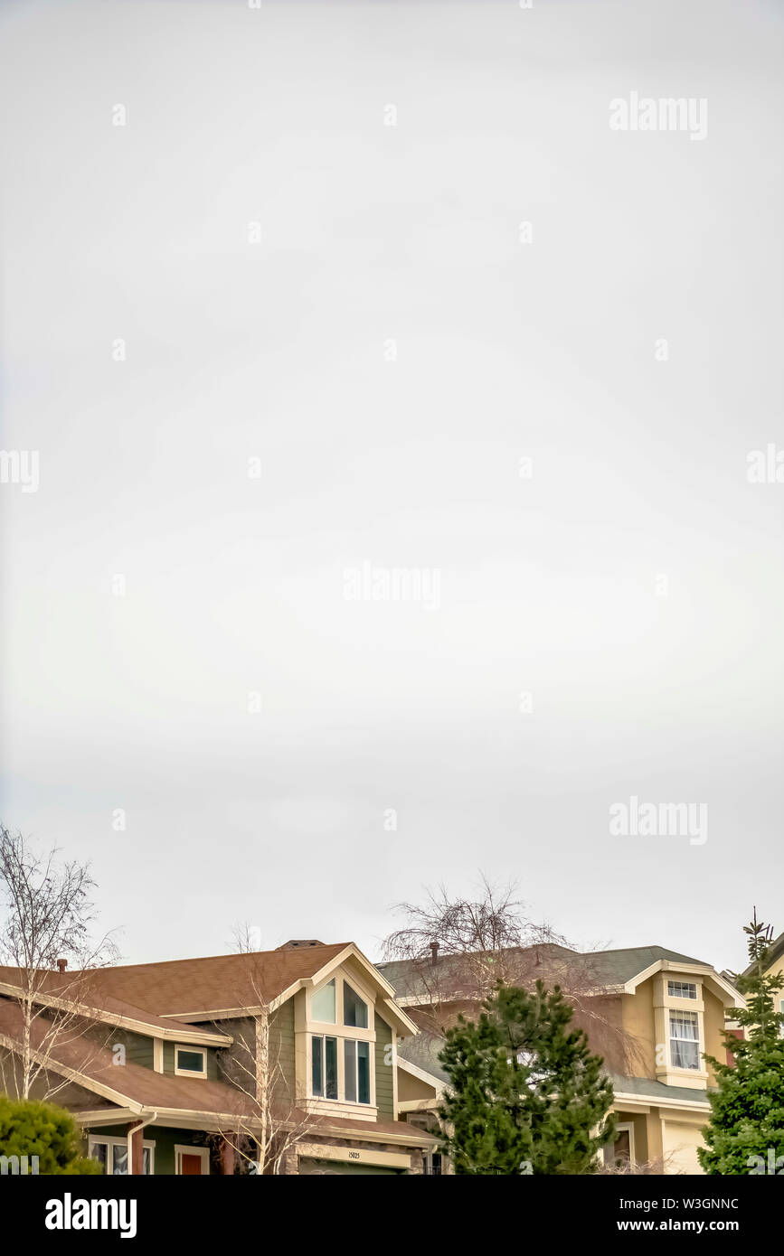 Exterior view of multi storey homes on a neighborhood under an overcast ...