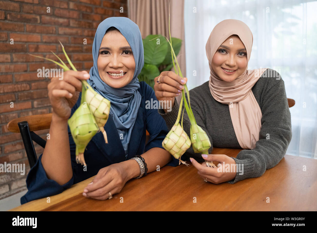 muslim women make traditional ketupat food Mother make traditional ...