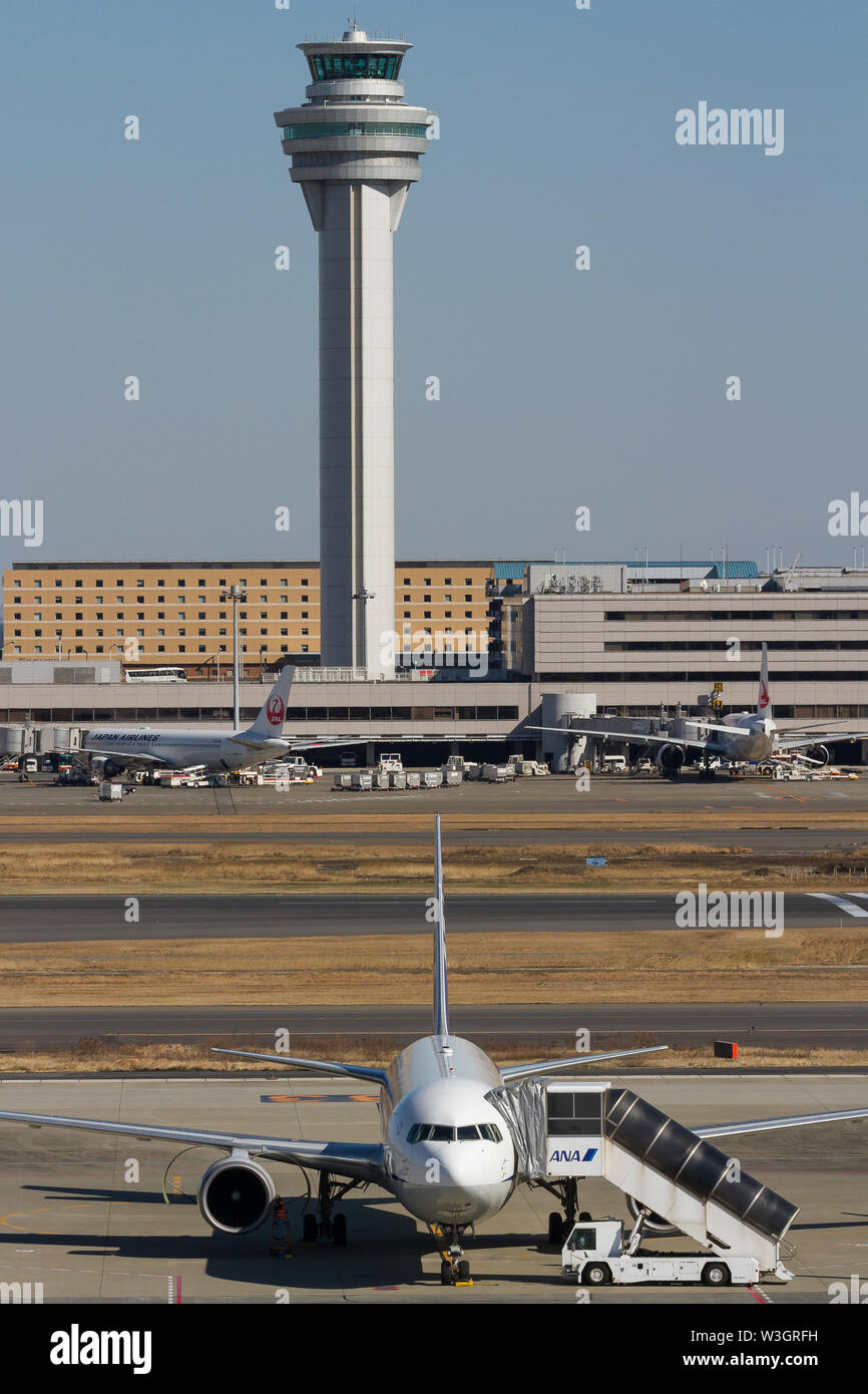 An All Nippon Airways (ANA) Boeing 757 airliner is serviced in front of ...