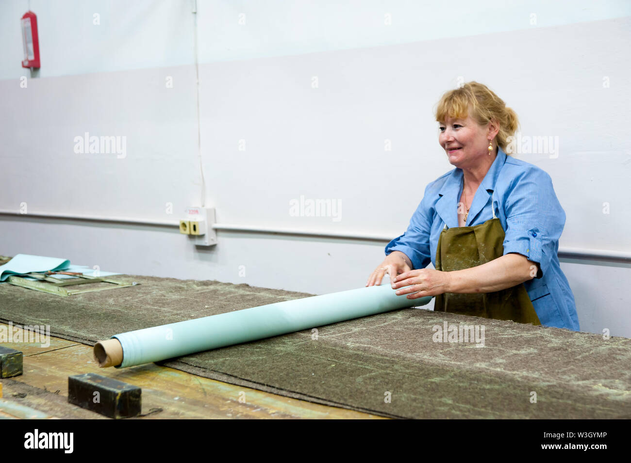 Woman does an element of an internal covering Stock Photo - Alamy