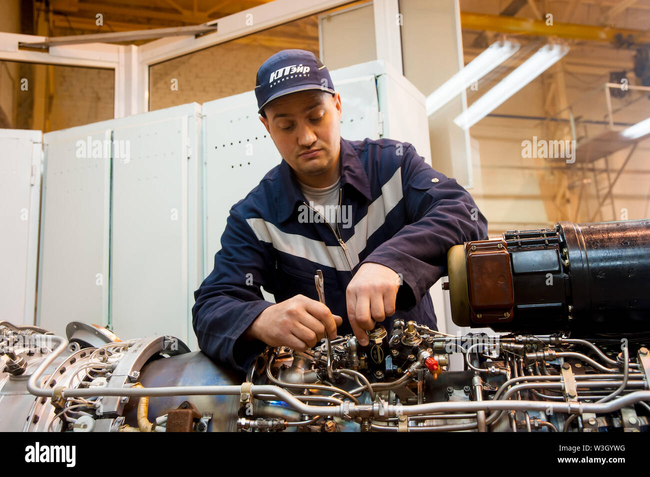Worker maintaining helicopter engine. Tyumen Stock Photo - Alamy