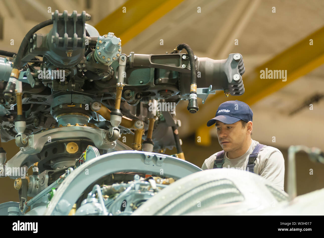 Worker maintaining helicopter engine. Tyumen Stock Photo - Alamy