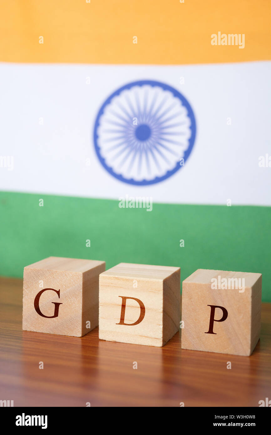 GDP or gross domestic product in wooden block letters, Indian Flag as a ...