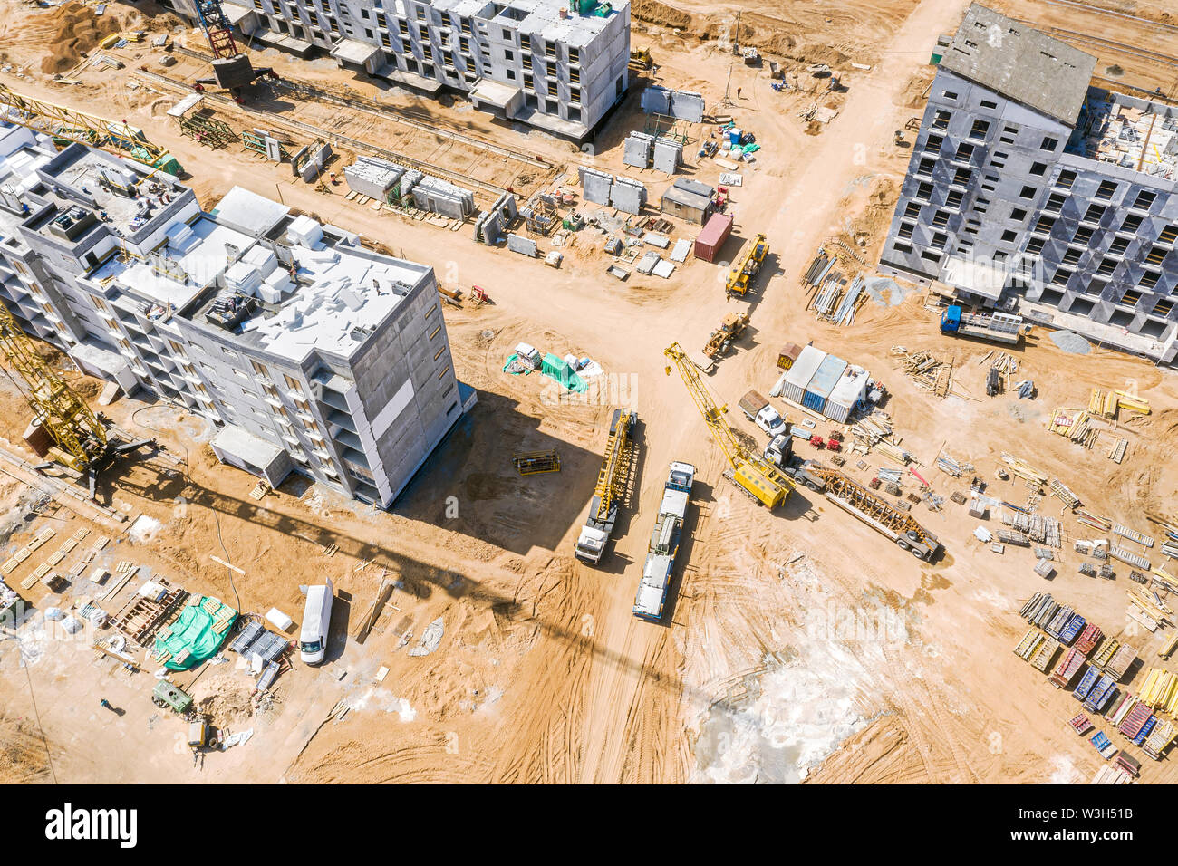 heavy building machines and equipment working at construction site ...