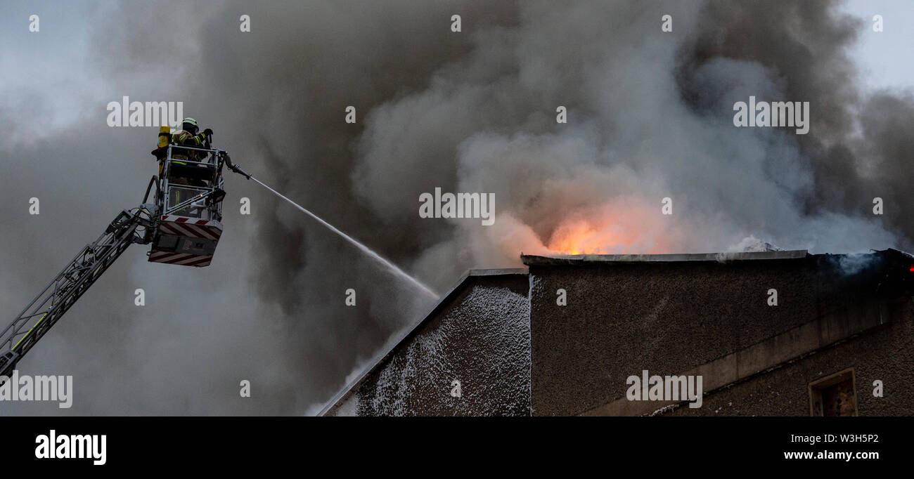 Berlin, Germany. 16th July, 2019. Dense smoke and flames stand above ...