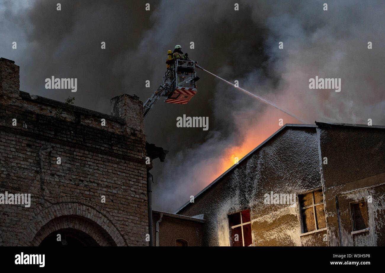 Berlin, Germany. 16th July, 2019. Dense smoke and flames stand above ...