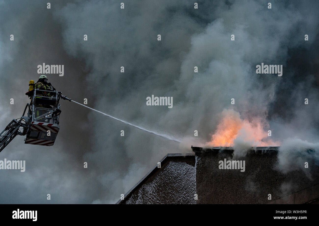 Berlin, Germany. 16th July, 2019. Dense smoke and flames stand above ...