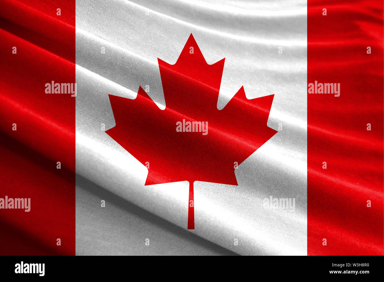 Realistic flag of Canada on the wavy surface of fabric Stock Photo - Alamy