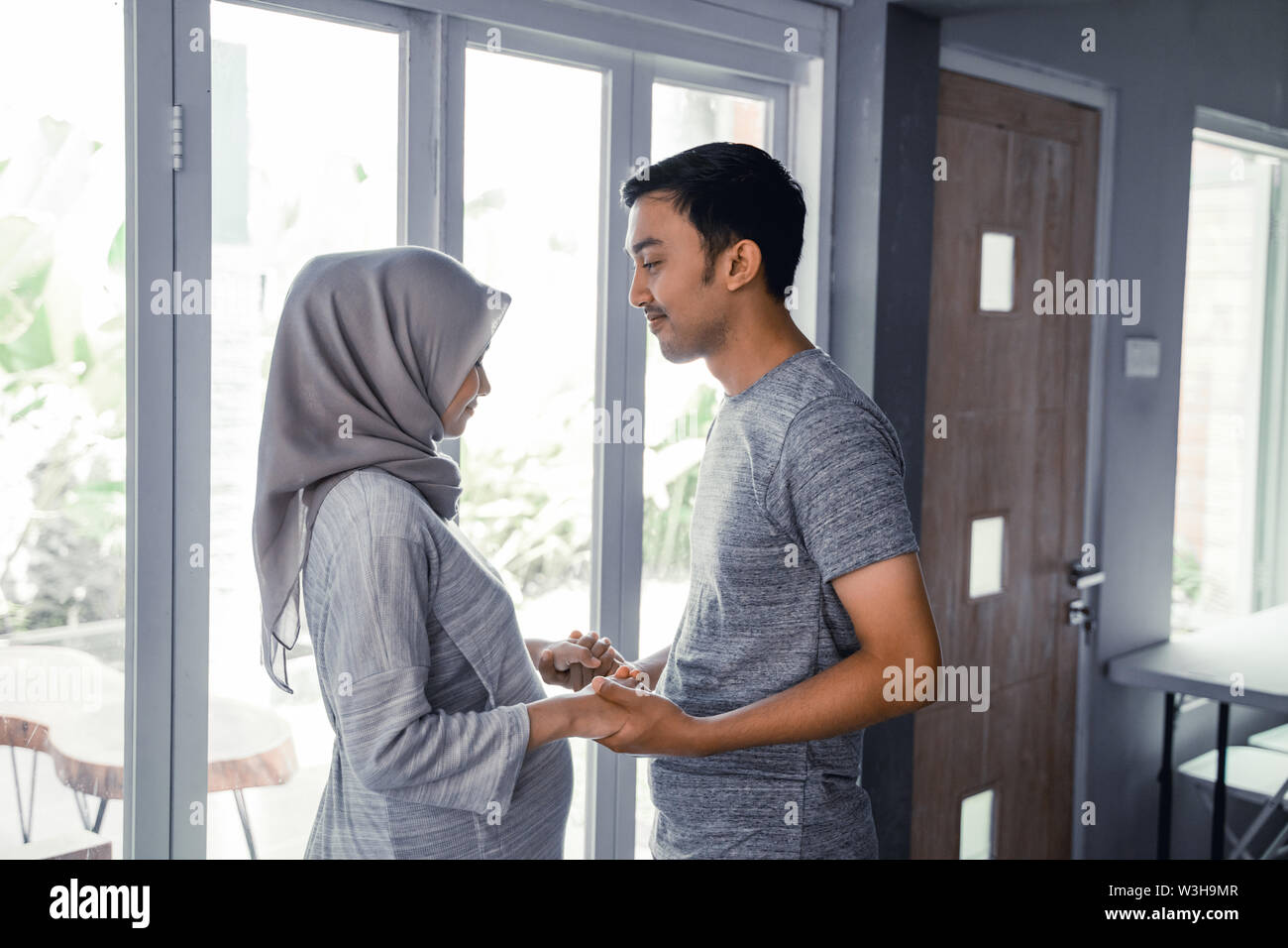 romantic muslim husband and wife face to face each other at home Stock ...