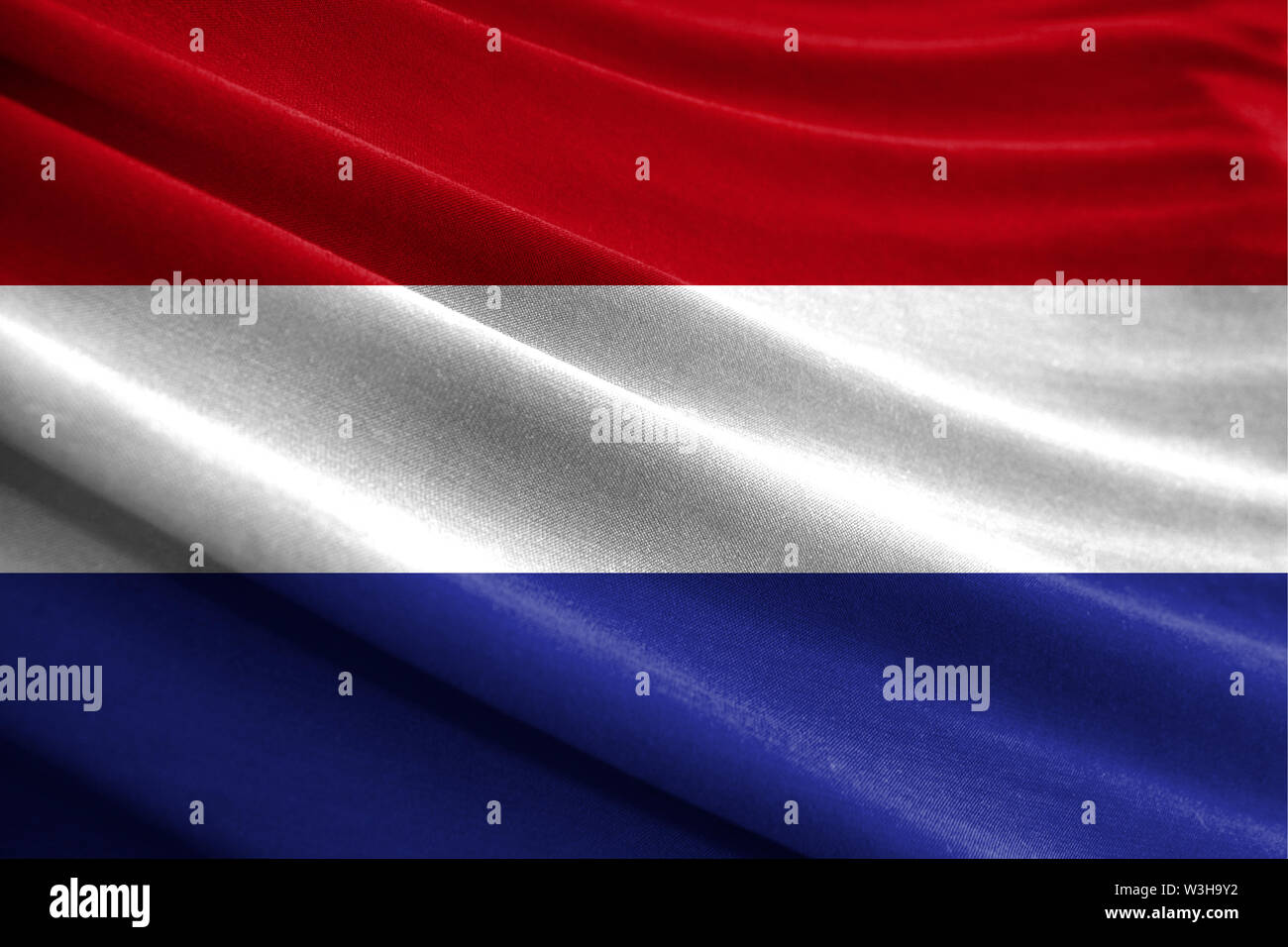 Realistic flag of Netherlands on the wavy surface of fabric Stock Photo ...