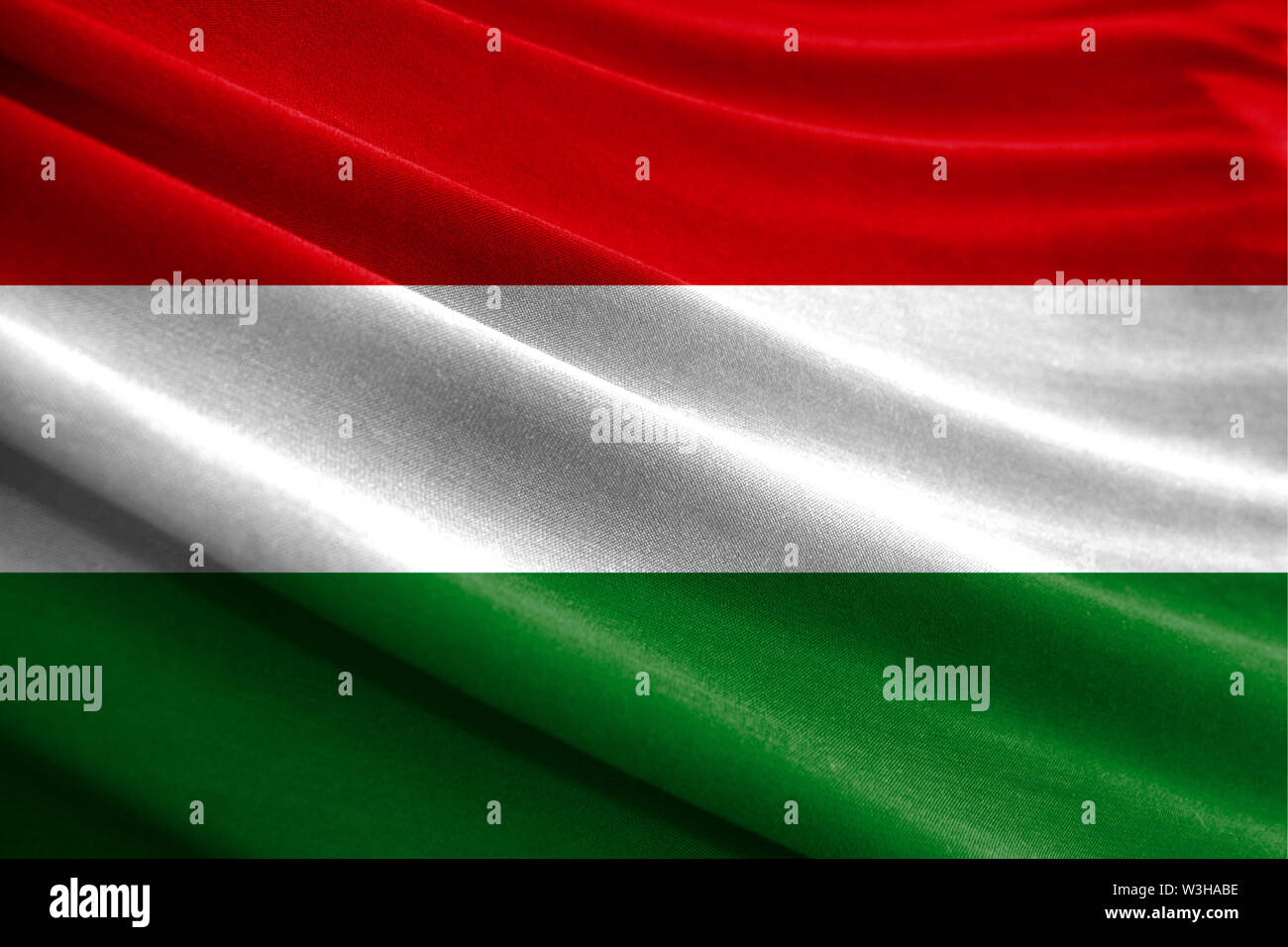 Realistic flag of Hungary on the wavy surface of fabric Stock Photo - Alamy
